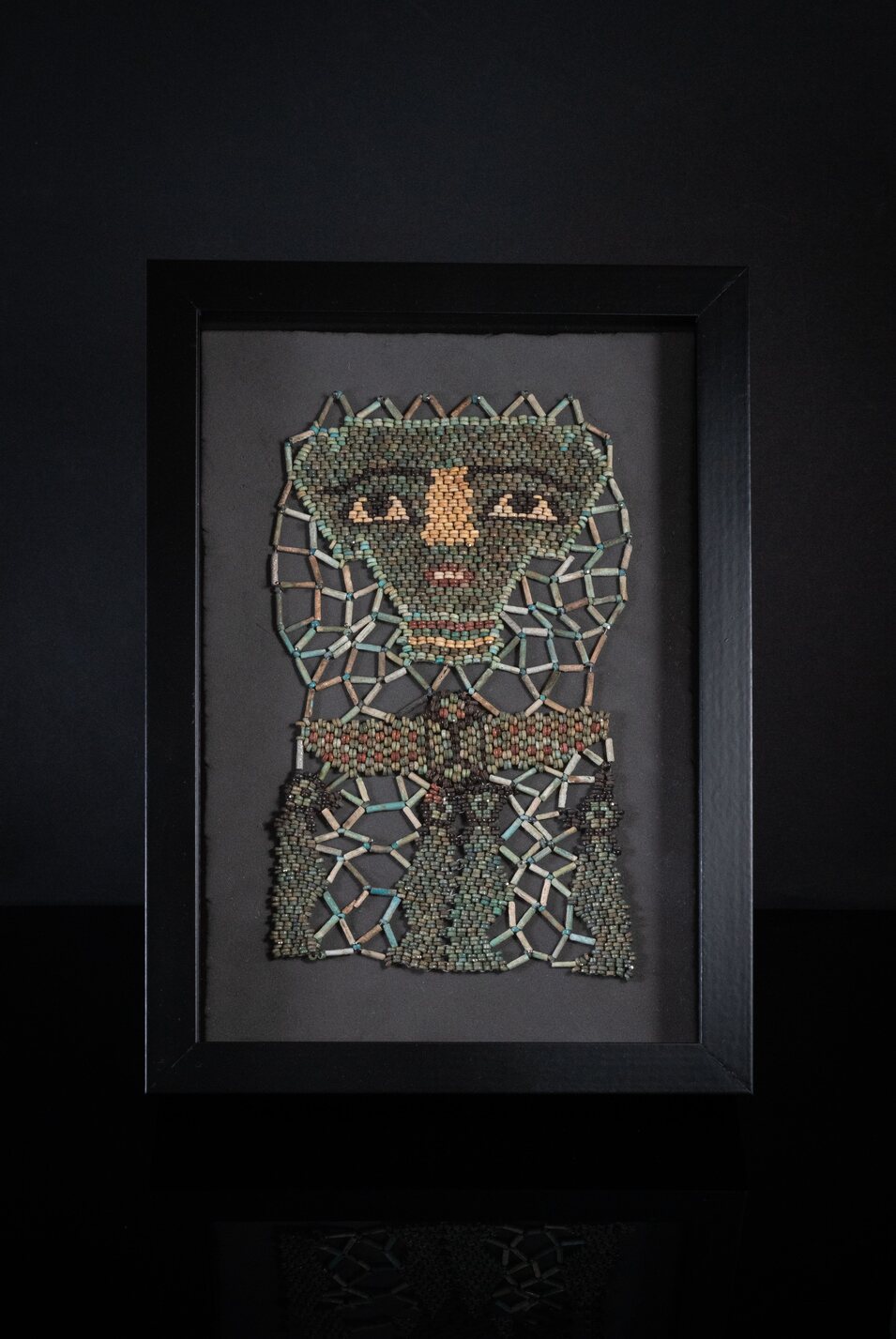 Ancient Egyptian mummy mask made of decorative beads, faience jewelry ...
